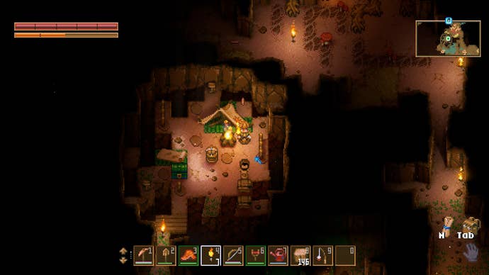 A little guy beside a tent in a dark cave in Core Keeper.