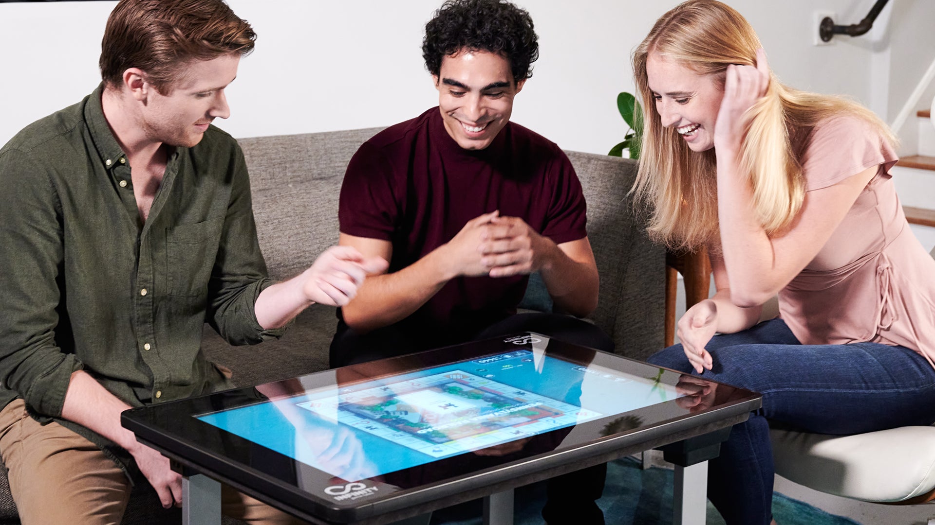High-tech game table Infinity includes digital versions of Monopoly ...